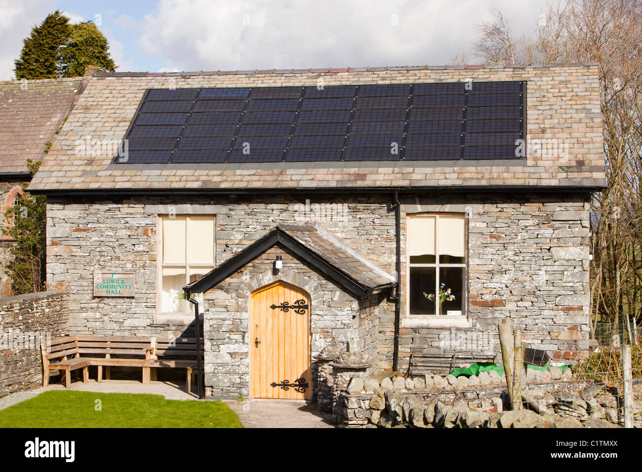 Solar electric panels on Lowick Village Hall in South Cumbria, UK Stock ...