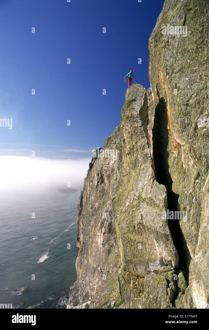 Person mountain climbing, Gogarth, Anglesey, Wales Stock Photo - Alamy