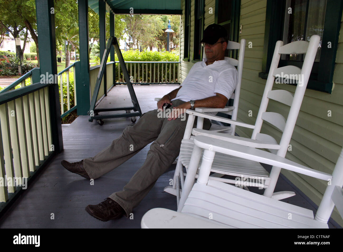 man relaxing on a rocking chair Stock Photo - Alamy
