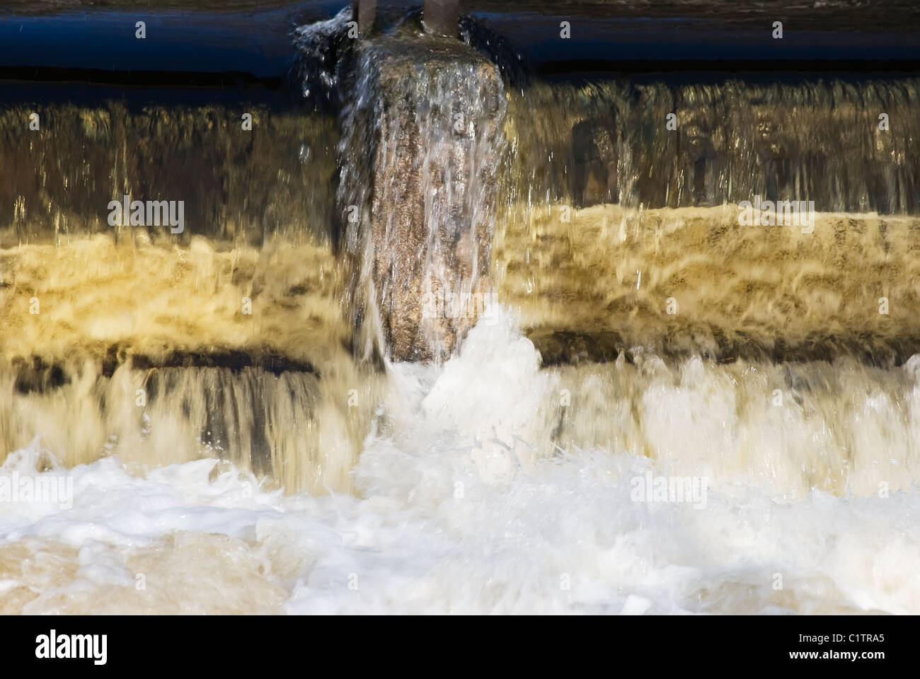 Spring water running from a dam in a river in Hollola Finland Stock ...