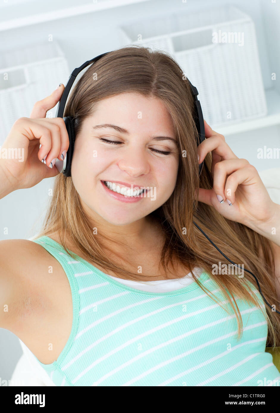 Good-looking girl listening to music Stock Photo - Alamy