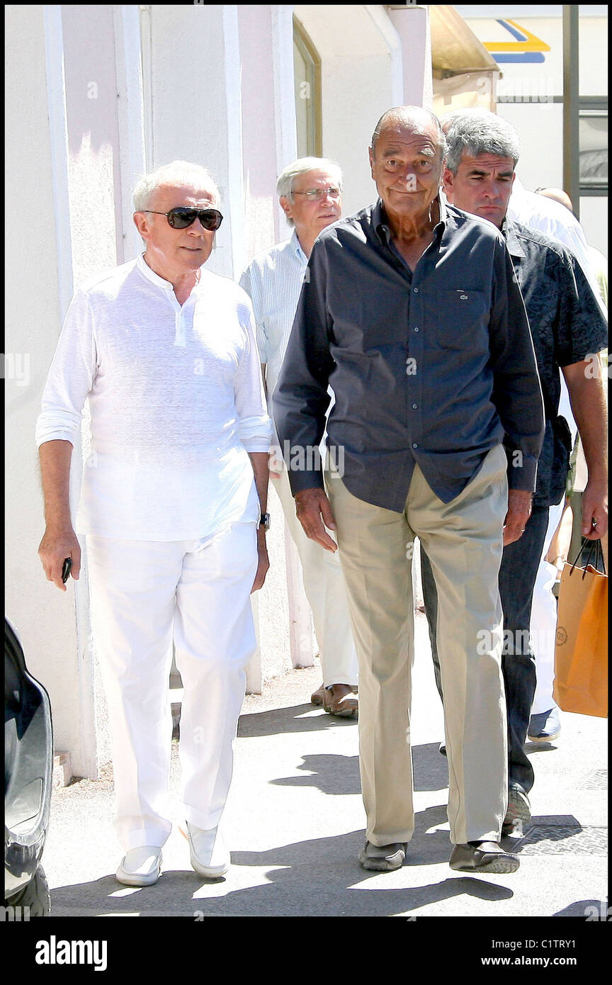 Former French president Jacques Chirac visits a market with friends ...