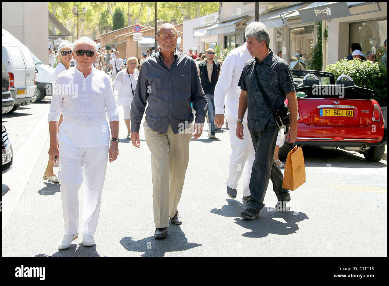 Former French president Jacques Chirac visits a market with friends ...