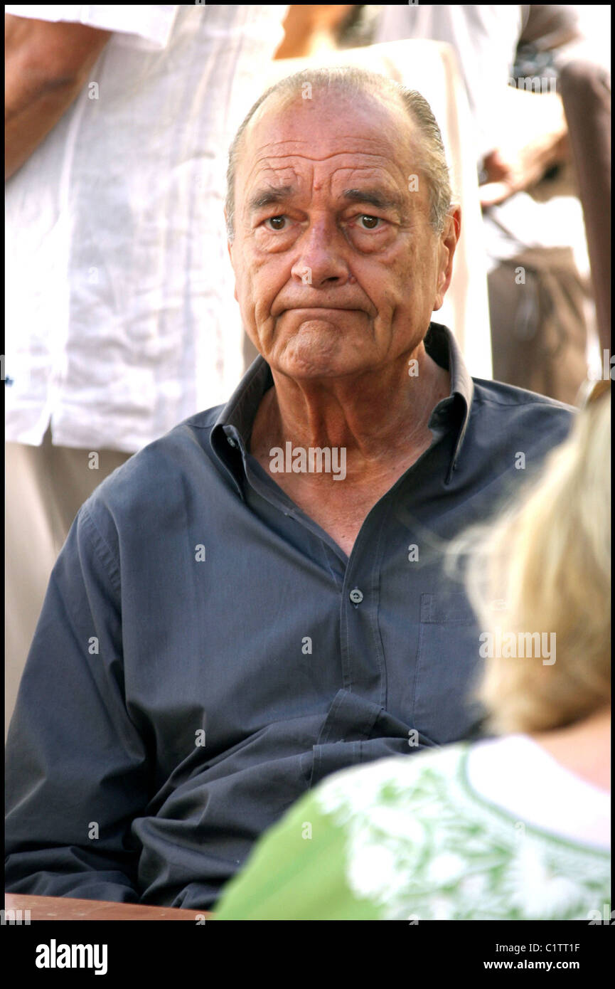 Former French president Jacques Chirac visits a market with friends ...
