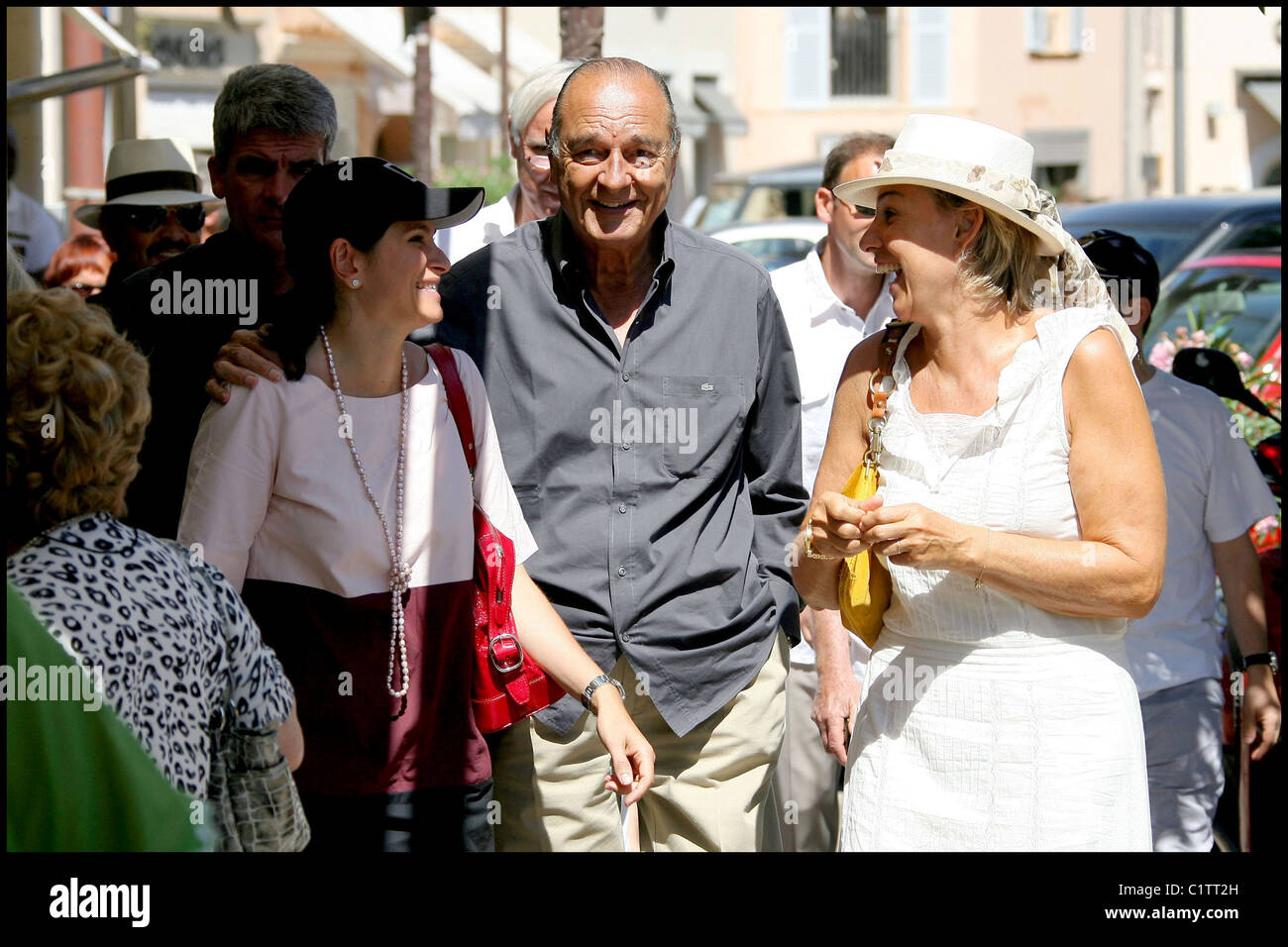 Former French president Jacques Chirac visits a market with friends ...