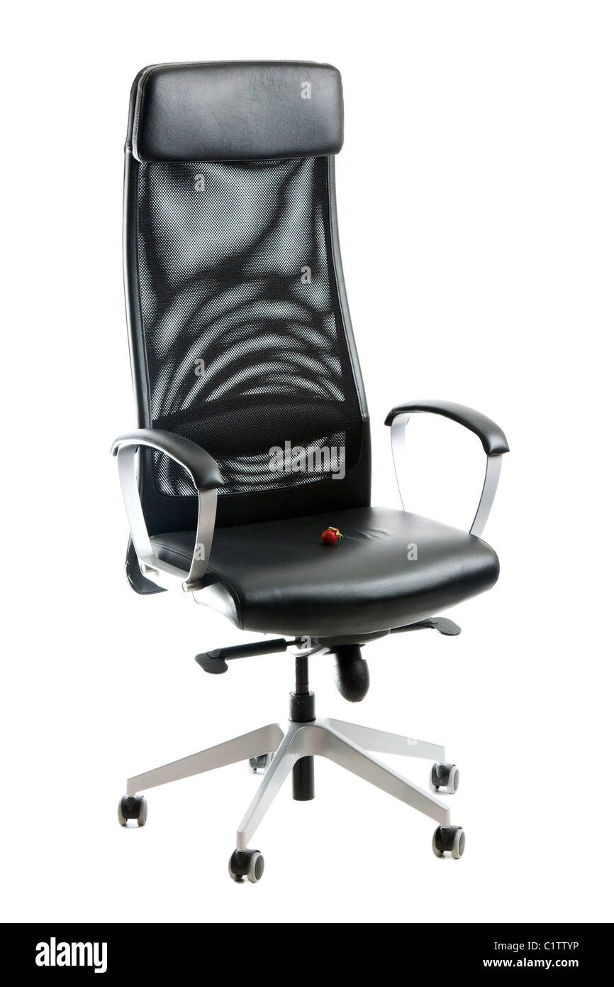 Berry of the strawberries on black leather easy chair on white ...