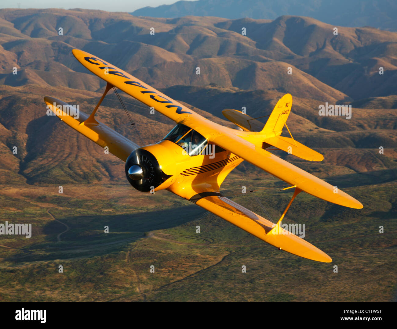 Yellow staggerwing biplane hi-res stock photography and images - Alamy