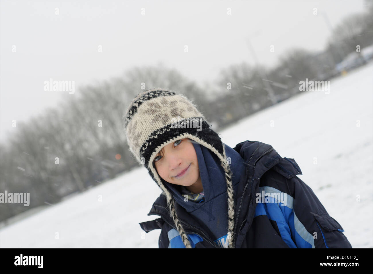 Young boy wrapped up for the cold weather Stock Photo - Alamy