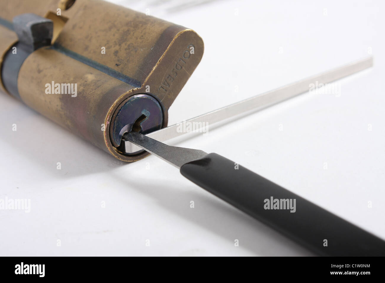 A set of amateur and professional lock picks; including a steel rake ...