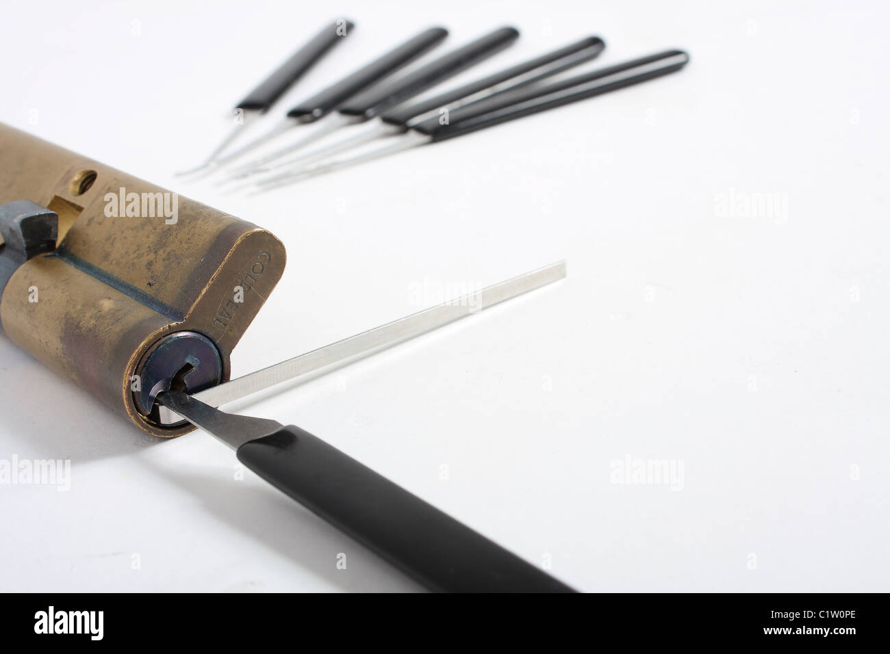 A set of amateur and professional lock picks; including a steel rake ...