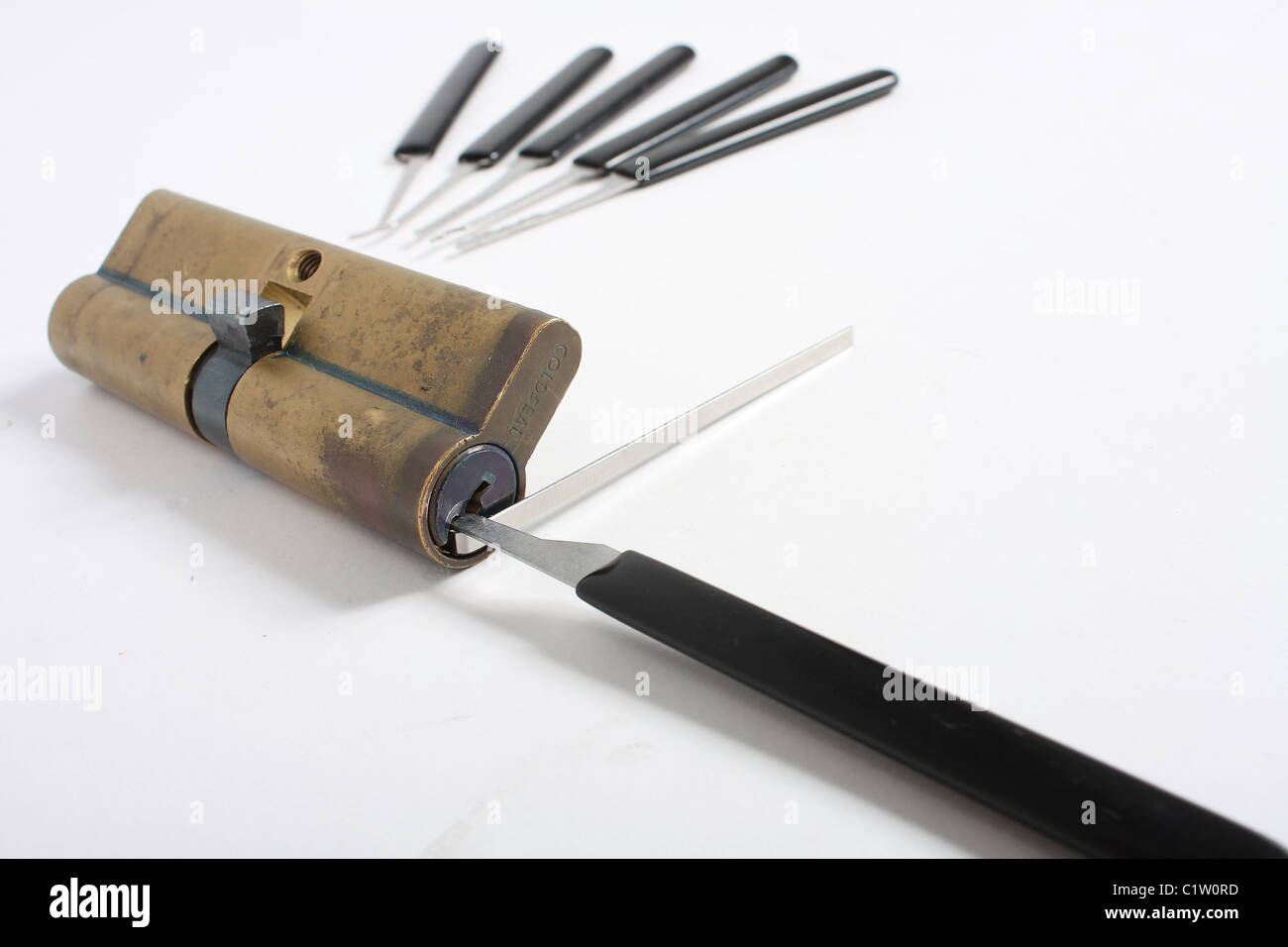A set of amateur and professional lock picks; including a steel rake ...