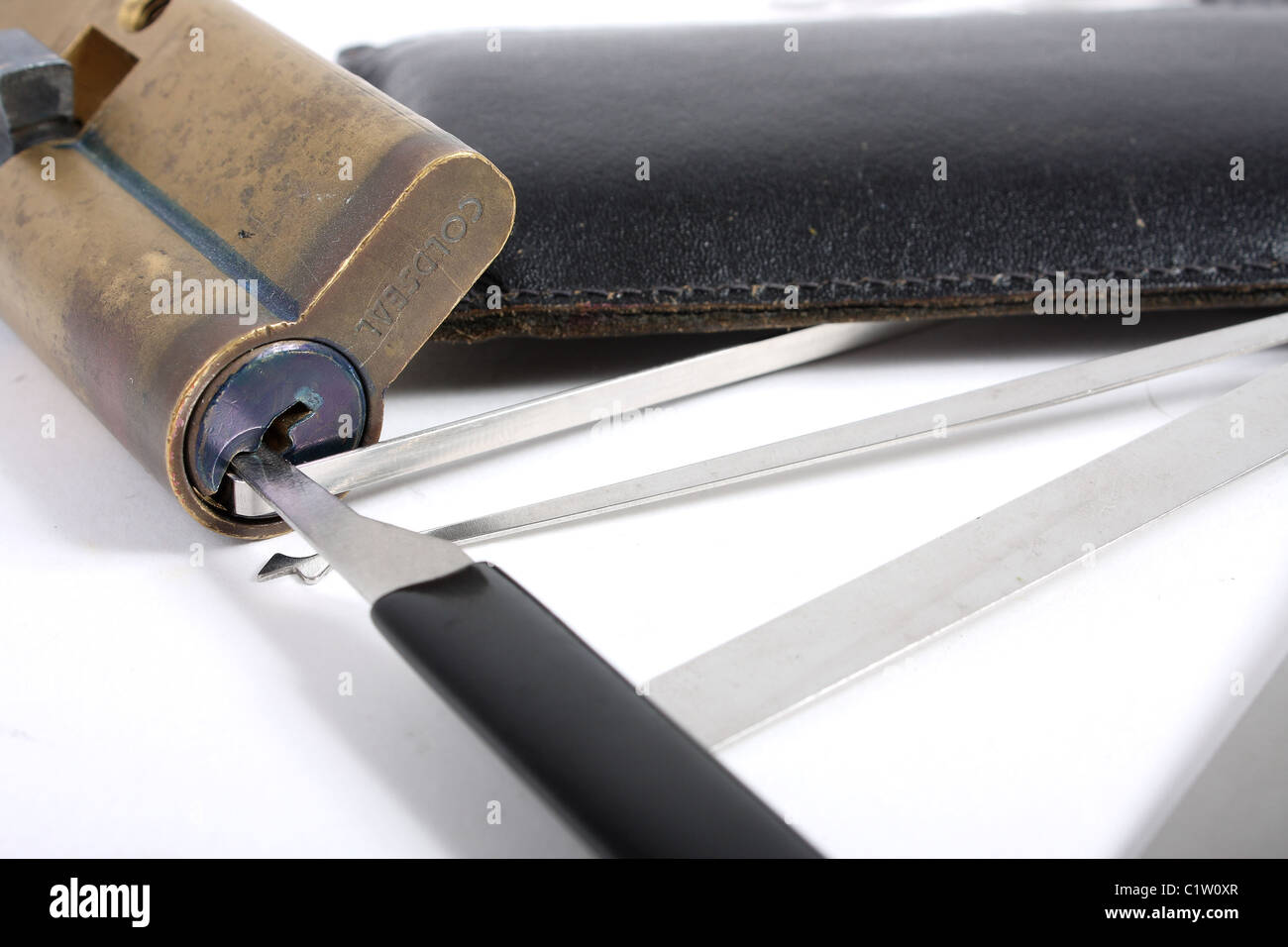 A set of amateur and professional lock picks; including a steel rake ...
