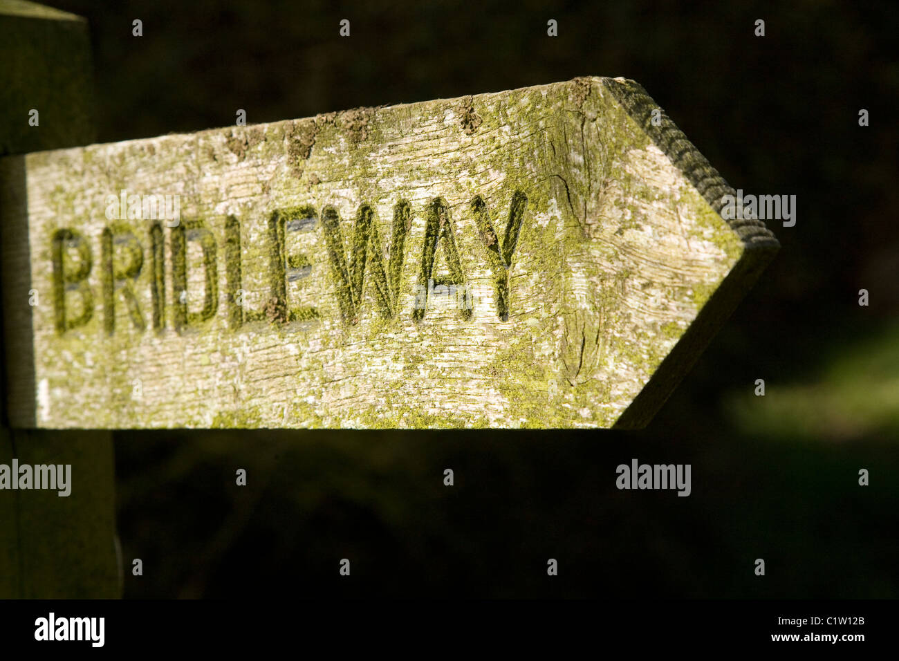 Wooden bridleway sign pointing direction arrow Stock Photo - Alamy