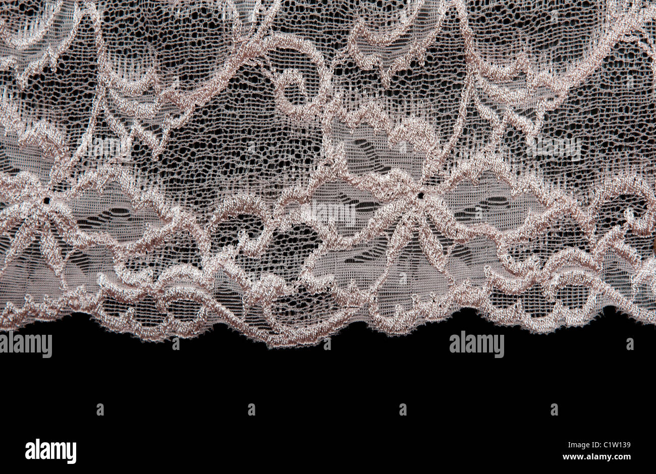 Rose pattern lace insulated on black background Stock Photo - Alamy