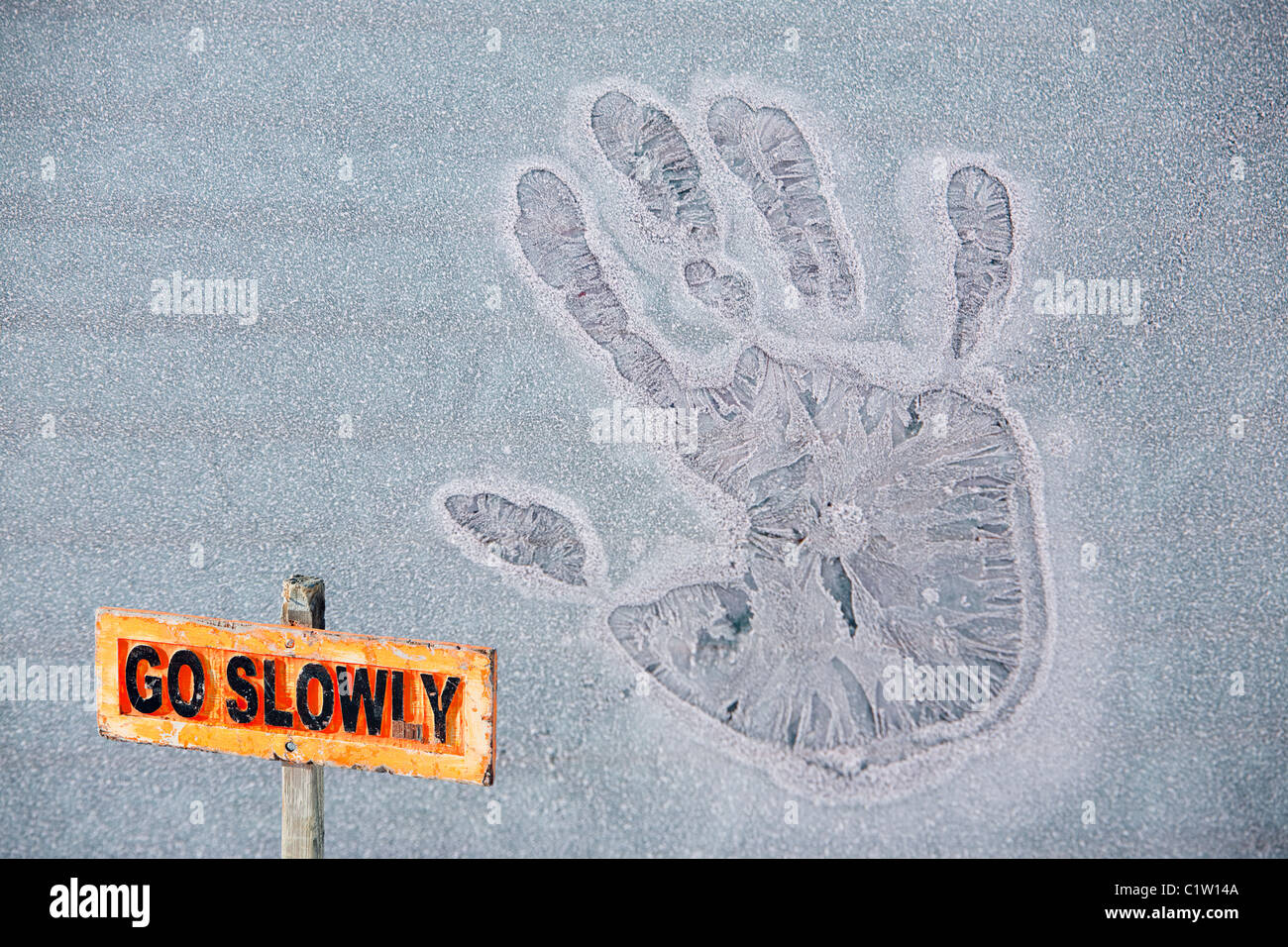 A frozen hand print on an iced over car window in Ambleside Cumbria UK ...