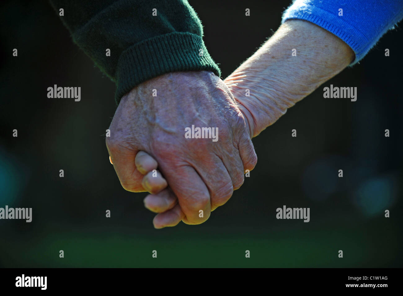 Elderly couple holding hands UK Stock Photo - Alamy