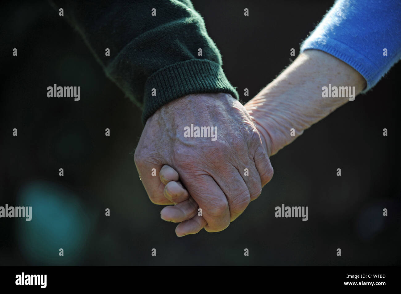 Elderly couple holding hands UK Stock Photo - Alamy