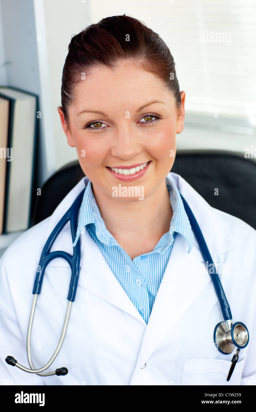 Happy female doctor smiling at the camera Stock Photo - Alamy