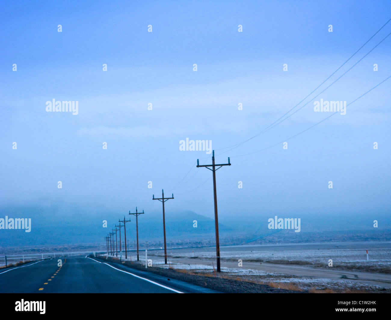Electricity pylons along a road hi-res stock photography and images - Alamy