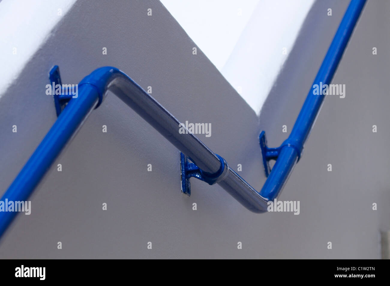 Blue Hand Rail on white wall Stock Photo - Alamy