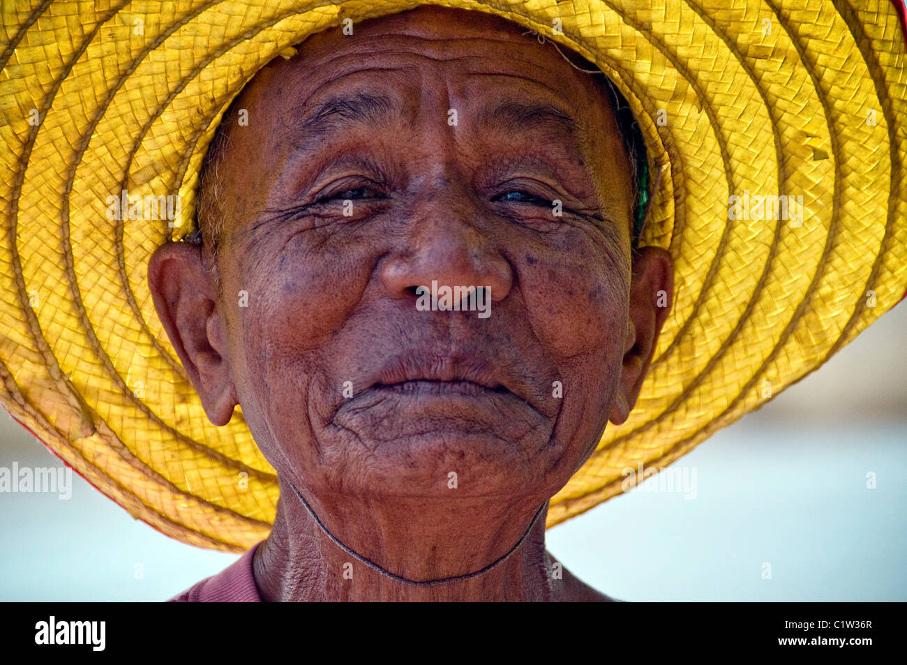 Thai farmer wearing a yellow straw hat near Khon Kaen, Thailand Stock ...