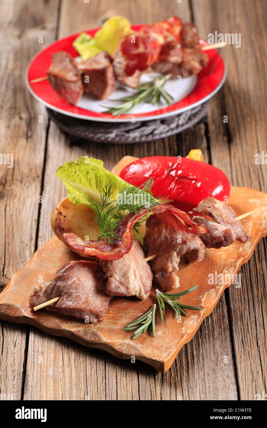 Shish kebab and rasher of crispy bacon Stock Photo - Alamy