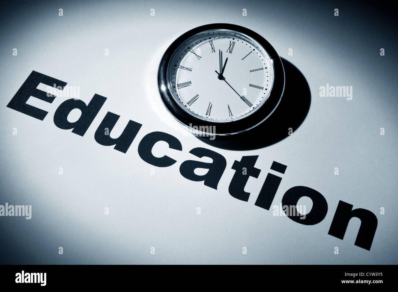 Clock and word of Education for background Stock Photo - Alamy
