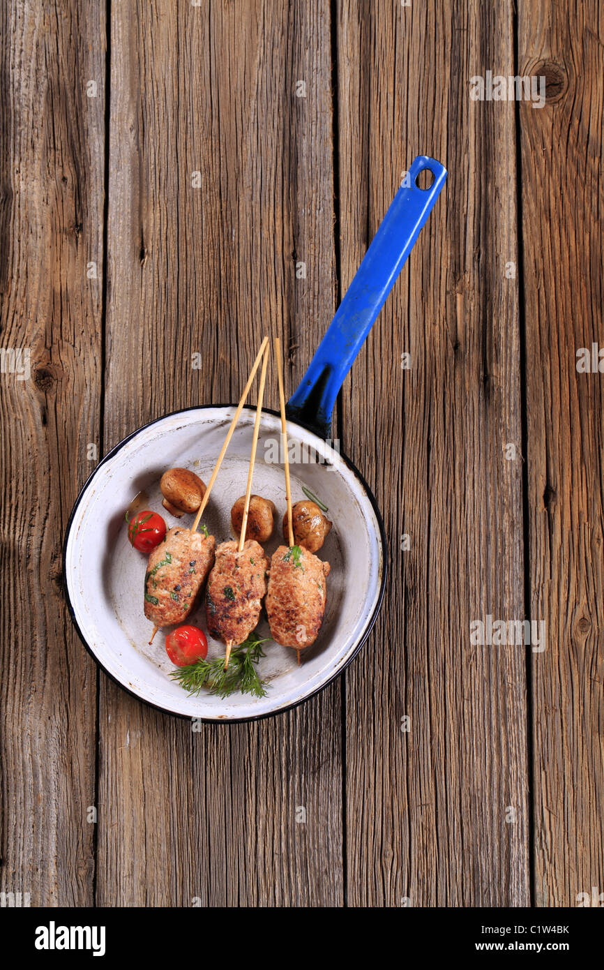 Minced meat kebabs on sticks - overhead Stock Photo - Alamy