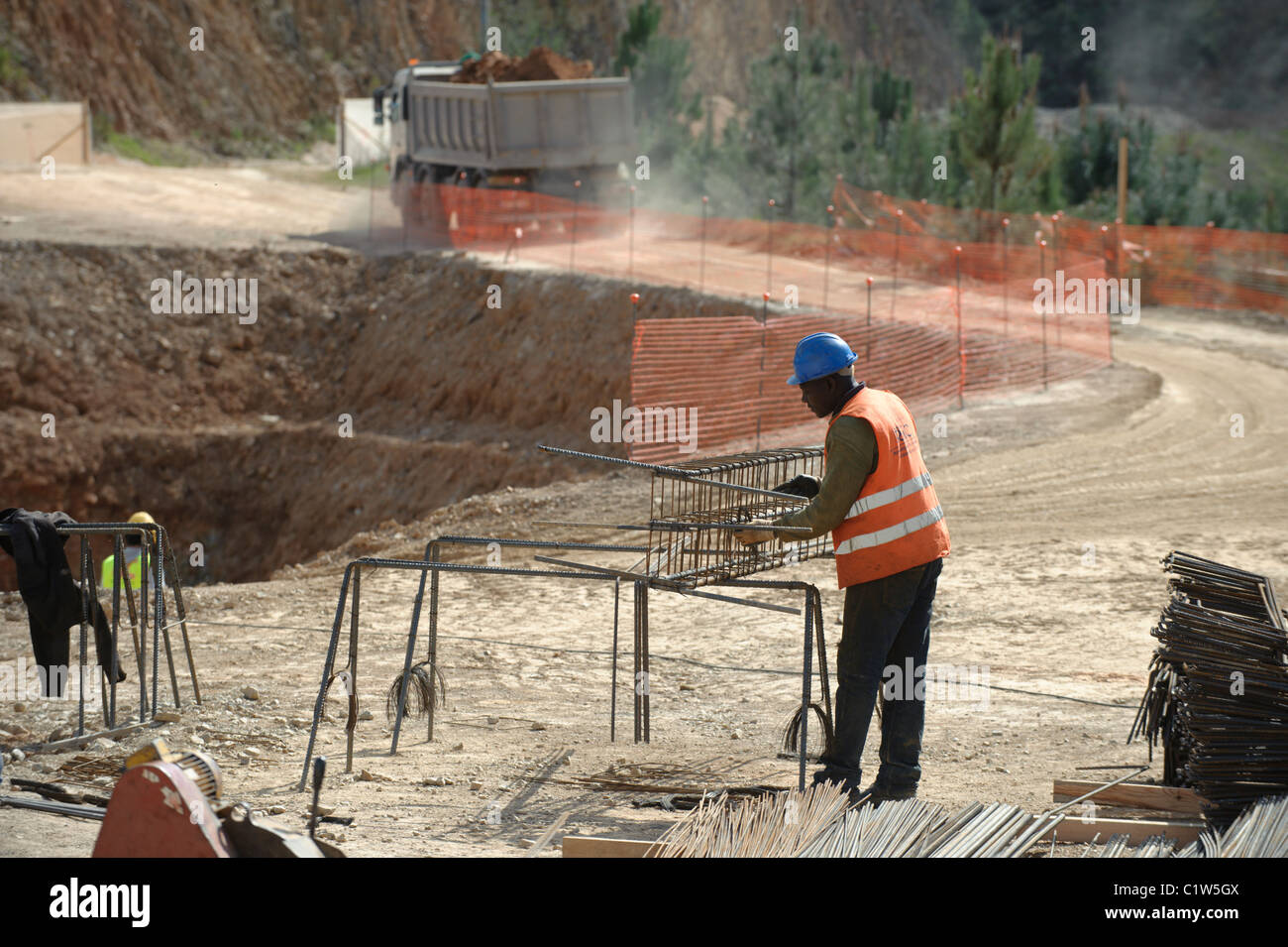 Construction worker at a construction site Stock Photo - Alamy