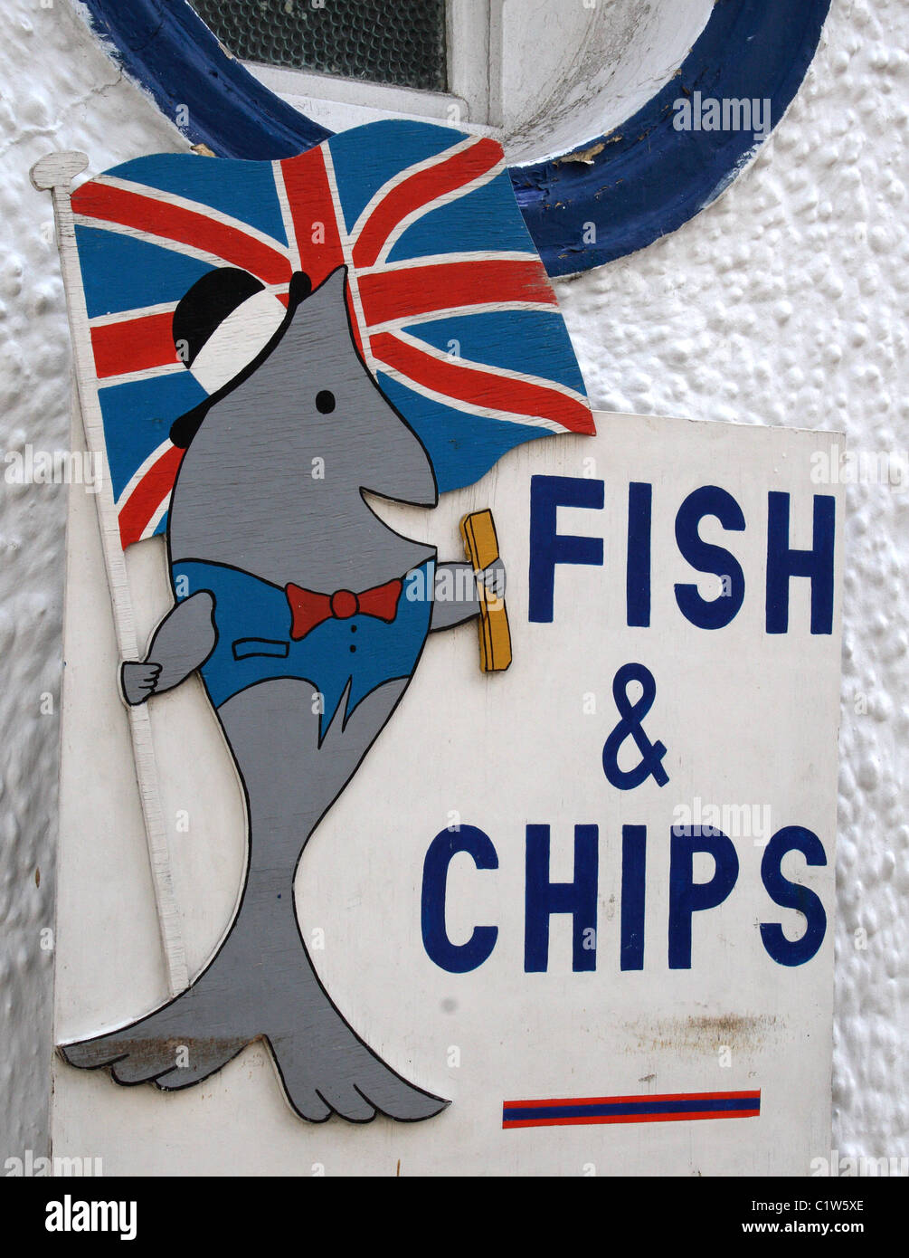 A traditional sign advertising Fish and Chips on the English coast ...