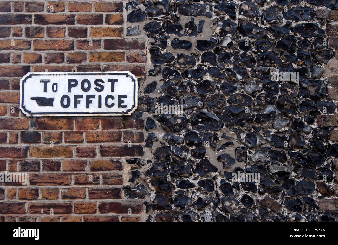 A traditional street sign indicating the post office Stock Photo - Alamy