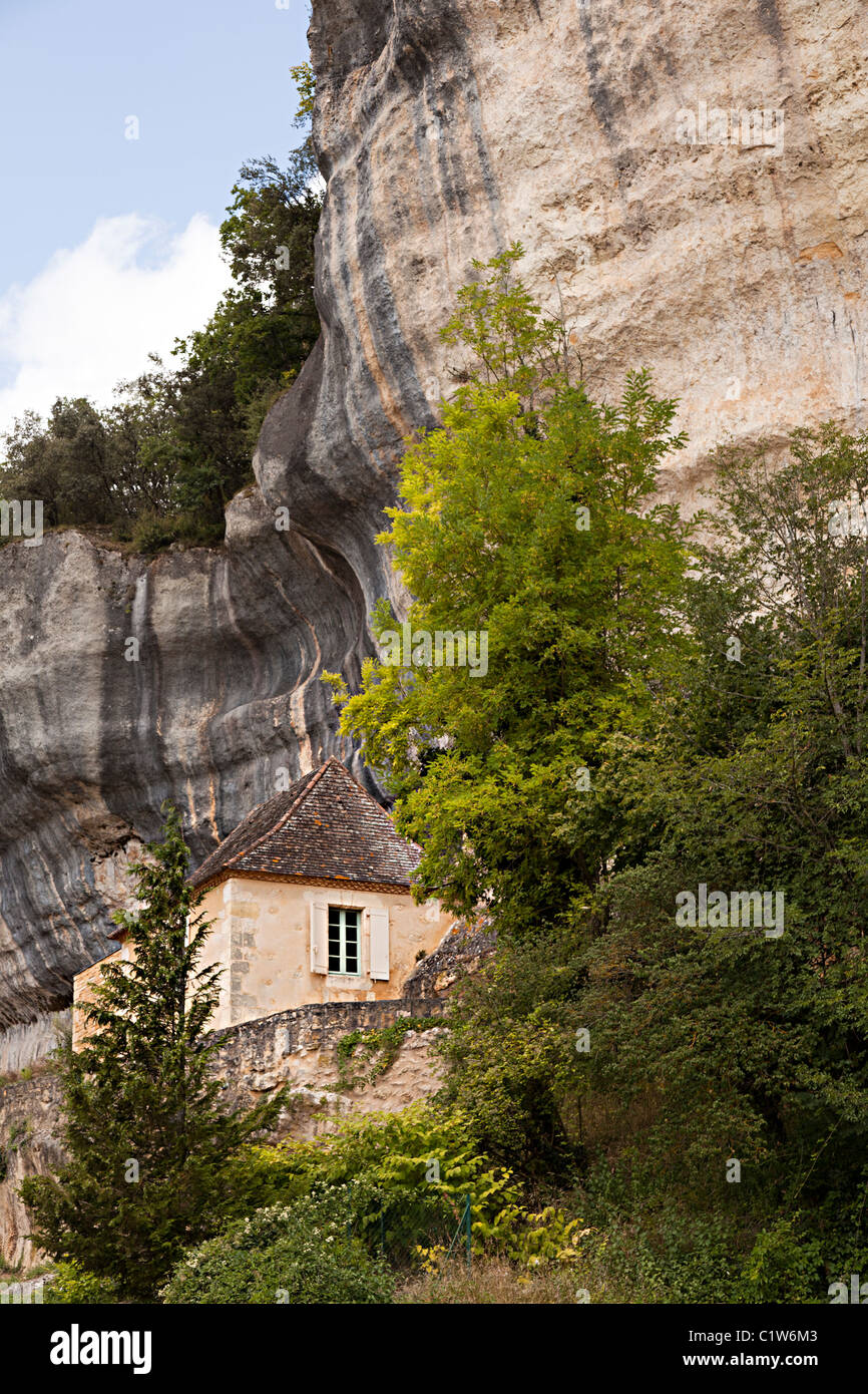 Building beneath cliff face overhang Les Eyzies Dordogne France French ...