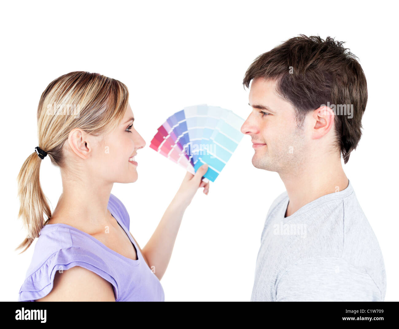 Bright couple choosing color for a room Stock Photo - Alamy