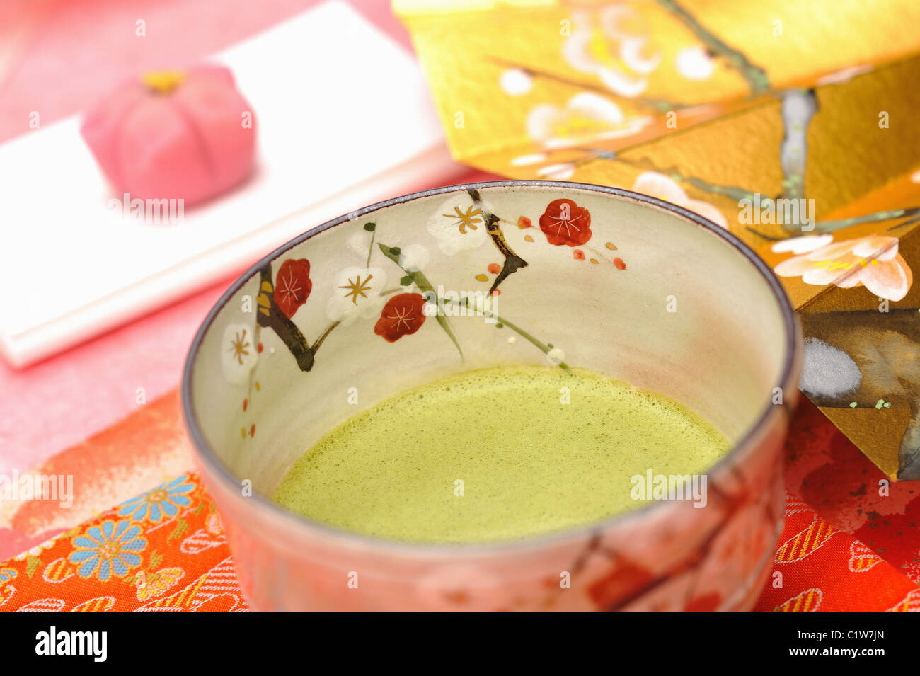 Maccha tea served with a teacake in tea ceremony Stock Photo - Alamy