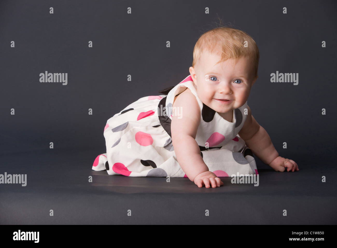 Close-up of a baby girl crawling Stock Photo - Alamy