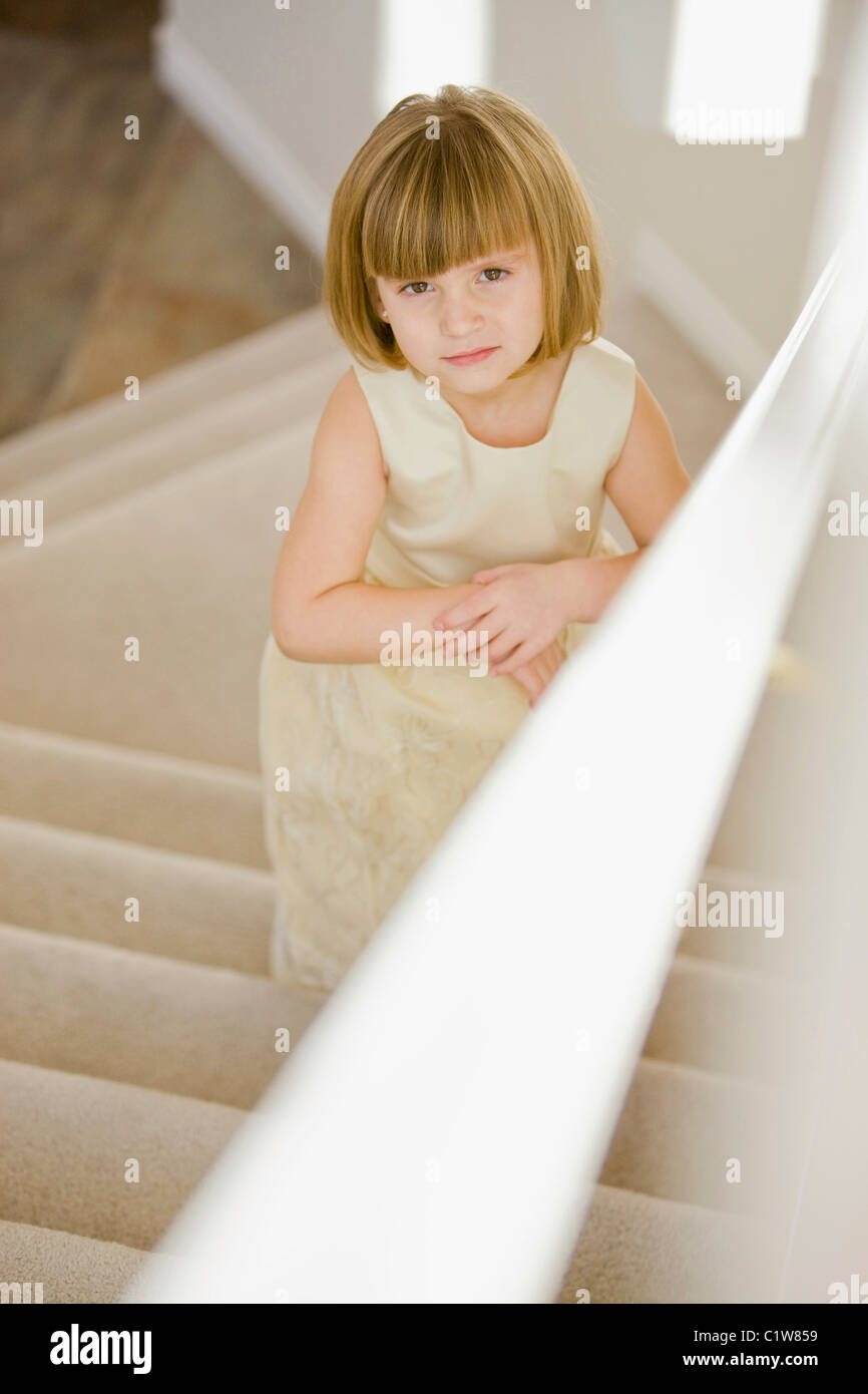 Girl sitting on a staircase Stock Photo - Alamy