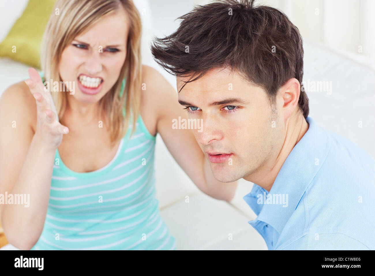 Young man ignoring his girlfriend getting worked up Stock Photo - Alamy