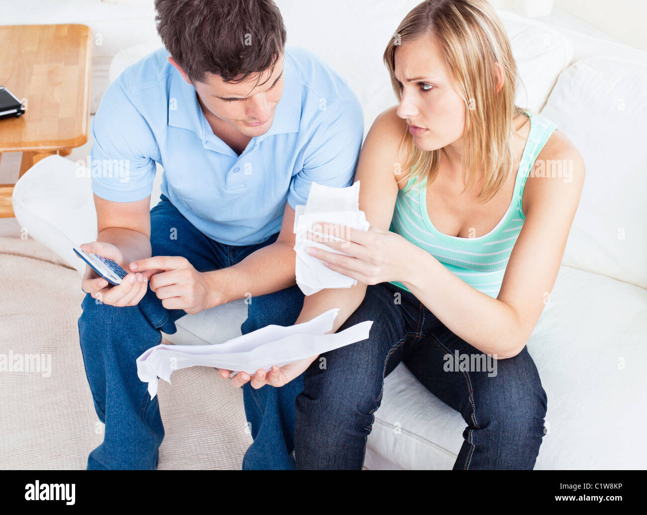 Couple making calculation Stock Photo - Alamy