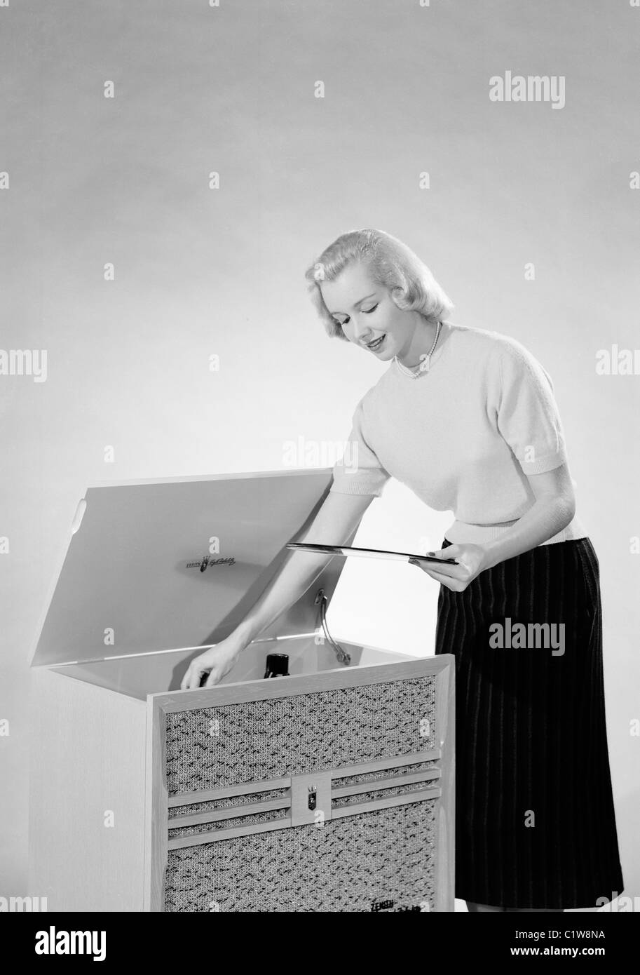 Woman vinyl record player Black and White Stock Photos & Images - Alamy