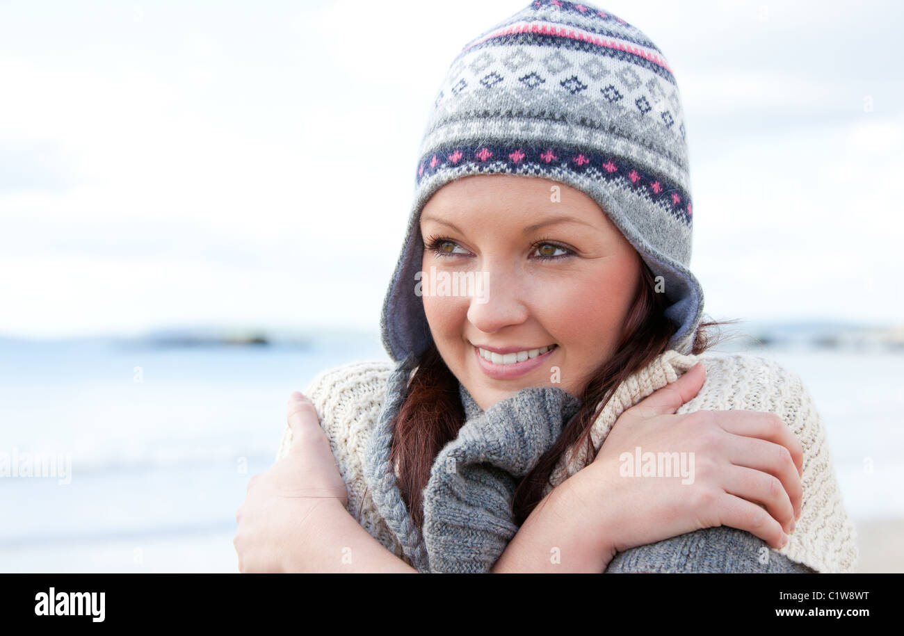 Pretty woman is cold wearing ha Stock Photo - Alamy