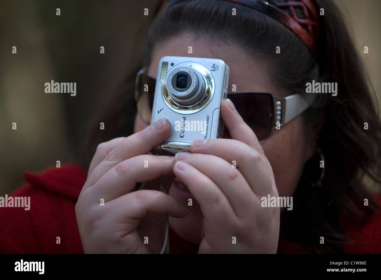 A blind student takes pictures during a photography workshop for the ...