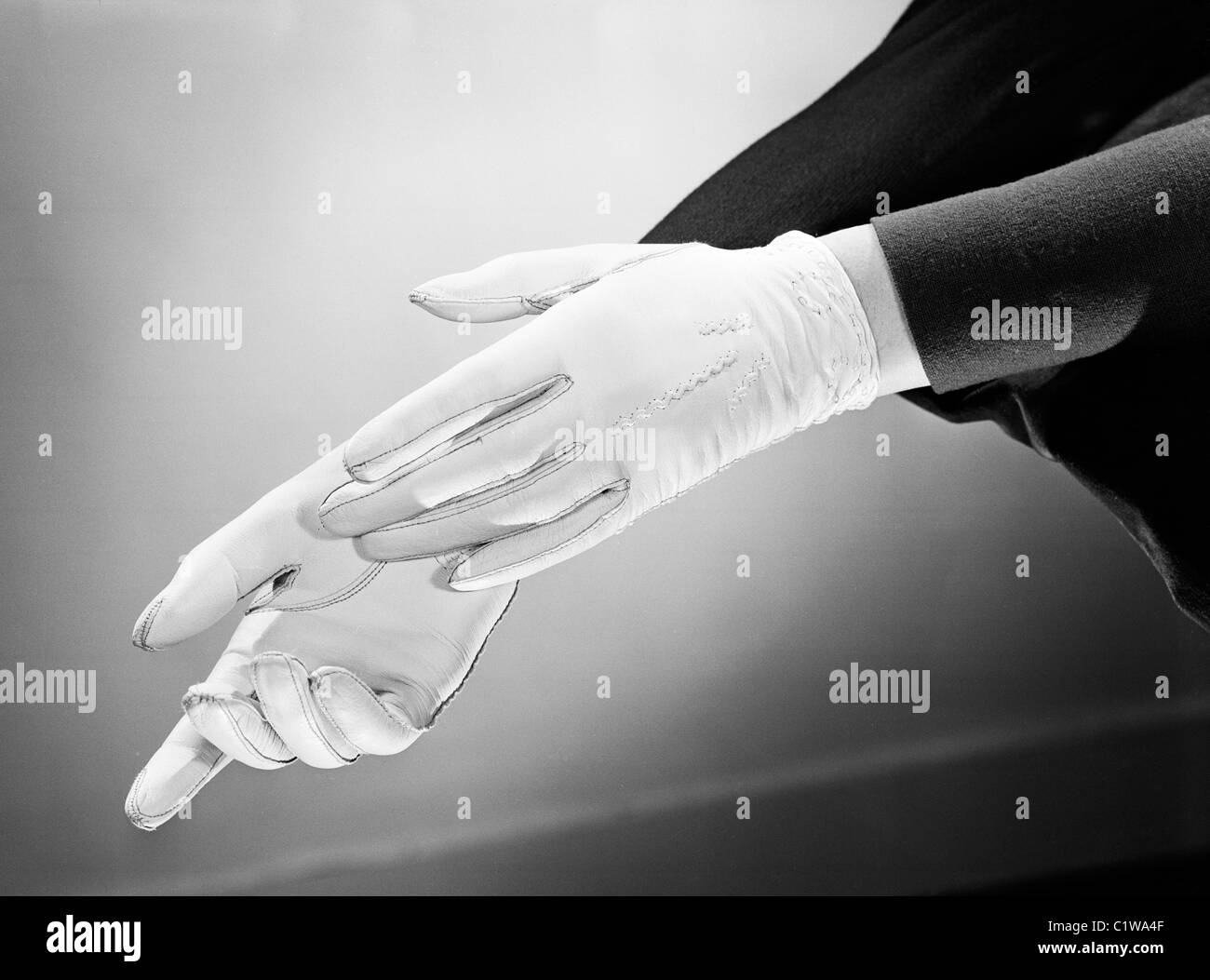 Hand putting black white Black and White Stock Photos & Images - Alamy