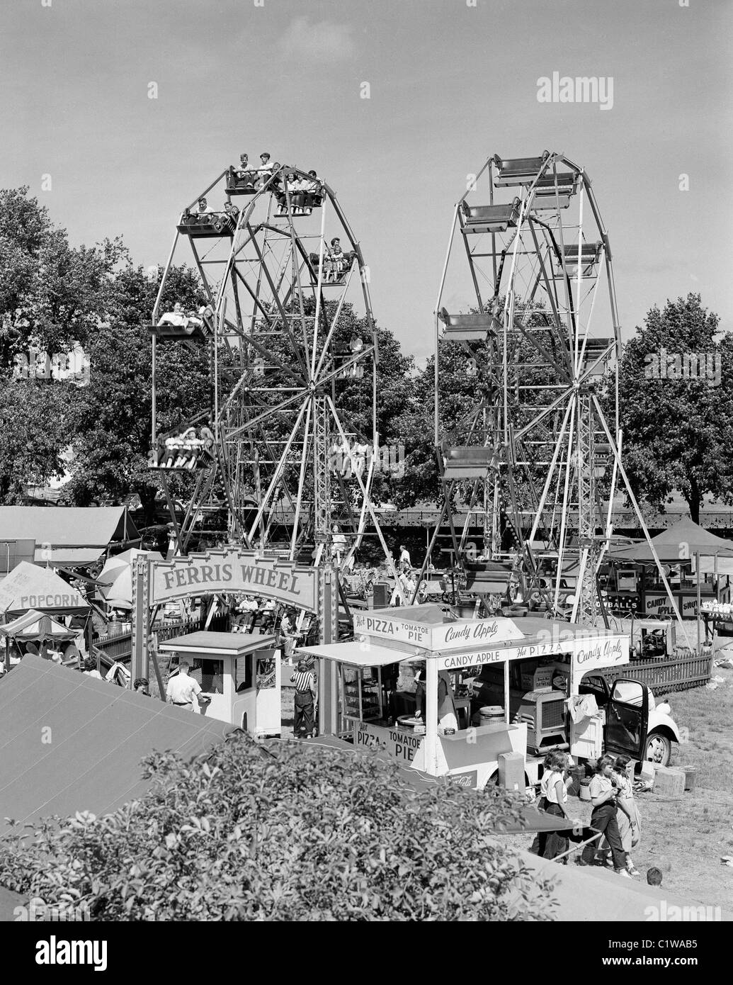 Ferris wheels at fun fair Stock Photo - Alamy