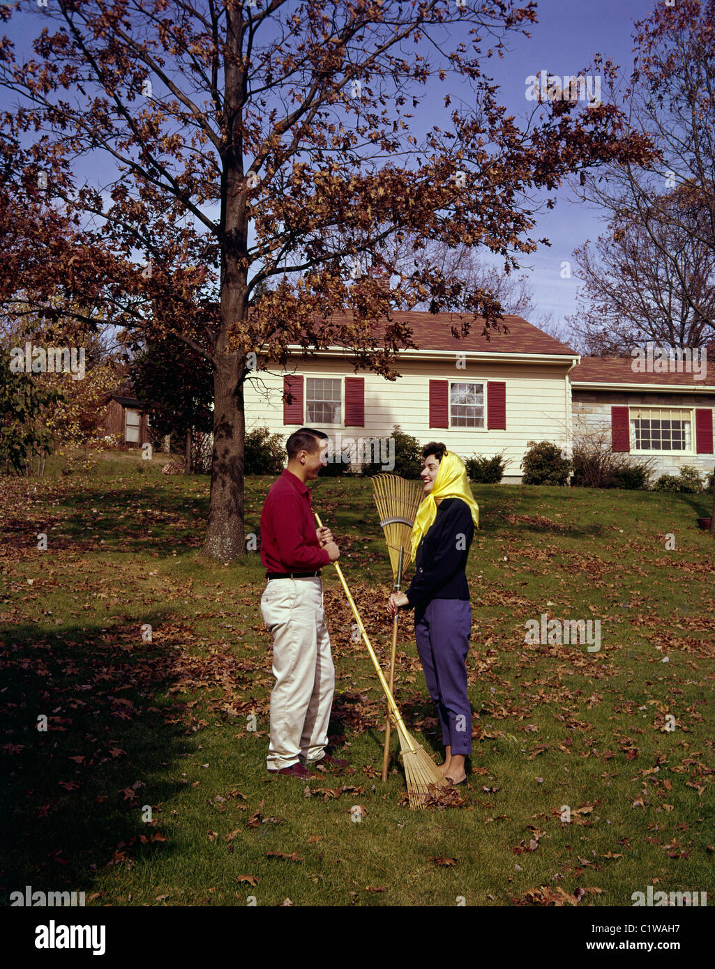Raking leaves autumn vintage hi-res stock photography and images - Alamy