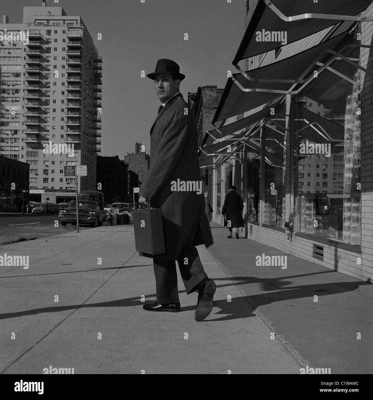 Man Walking Looking Over Shoulder