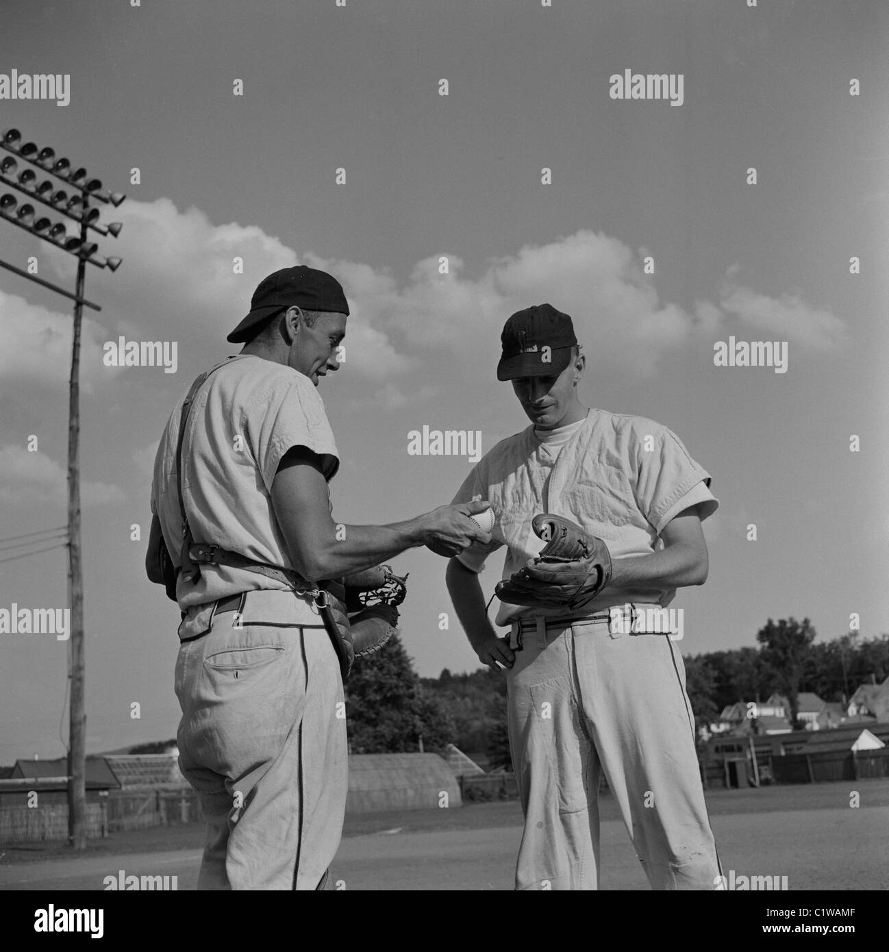 Two baseball players talking Stock Photo - Alamy