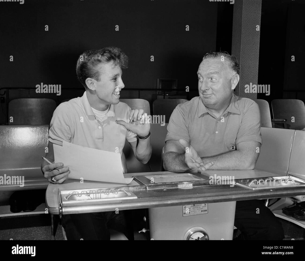 Sitting talking at table Black and White Stock Photos & Images - Alamy