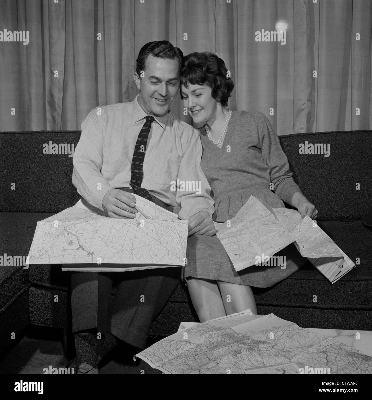 Two people reading map Black and White Stock Photos & Images - Alamy