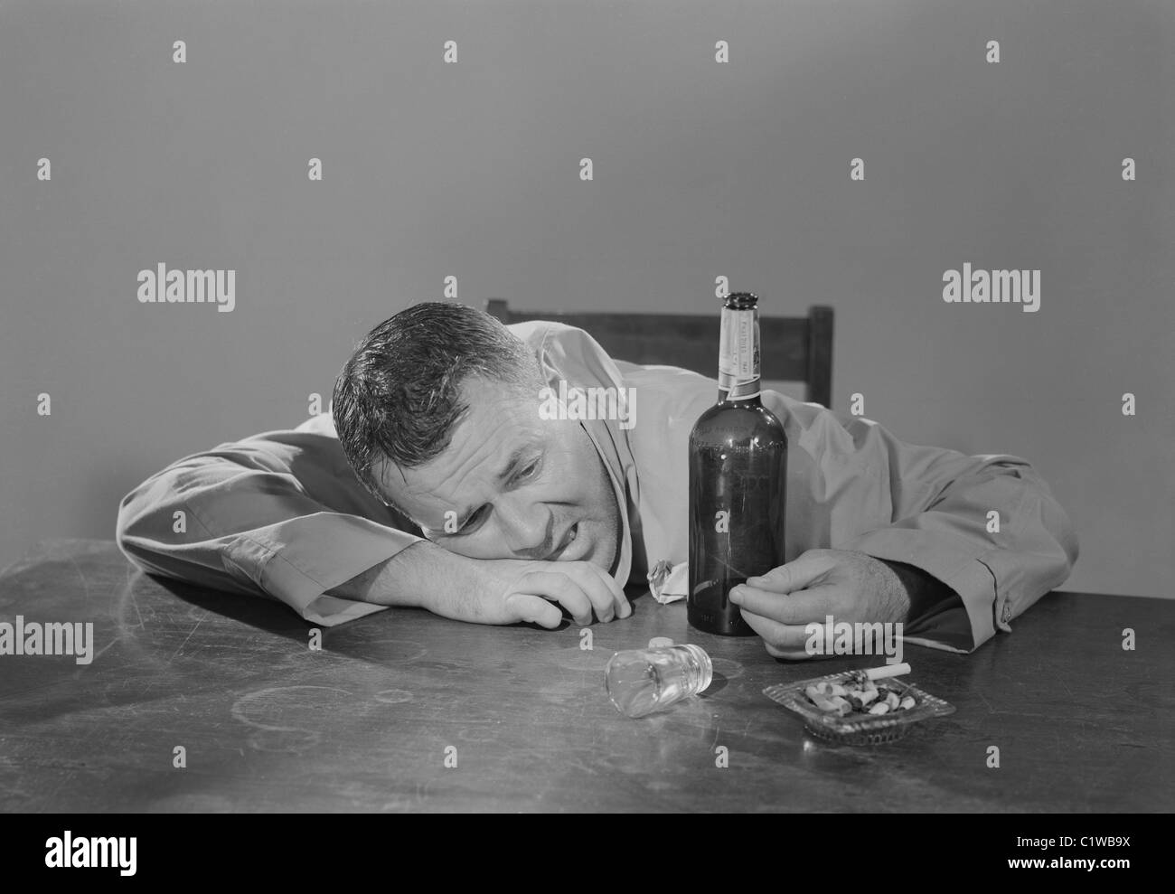 Drunk Man Sitting Table Alcohol Stock Photos & Drunk Man Sitting Table ...