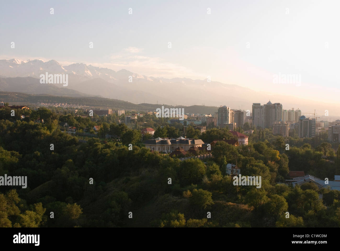 Kazakhstan, Almaty, Skyline with Altai Mountain Range in background ...